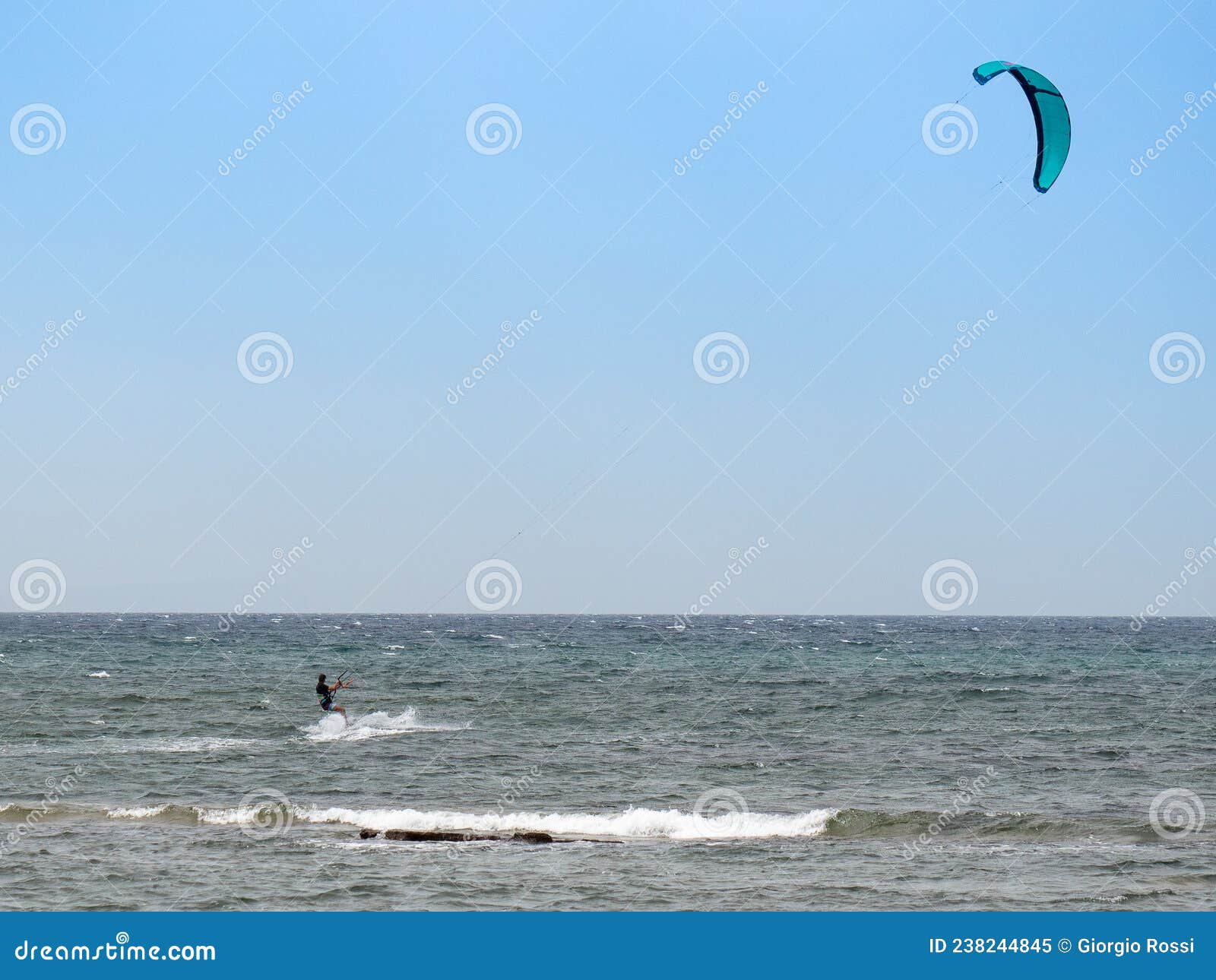 Kitesurfing during a Windy Day with a Very Rough Sea Stock Image ...