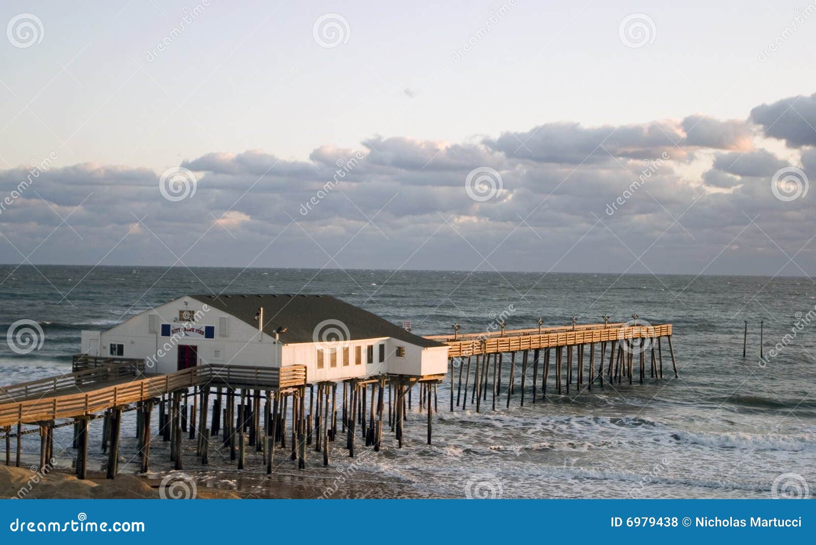 Kitty Hawk Pier at Sunrise stock photo. Image of outer - 6979438