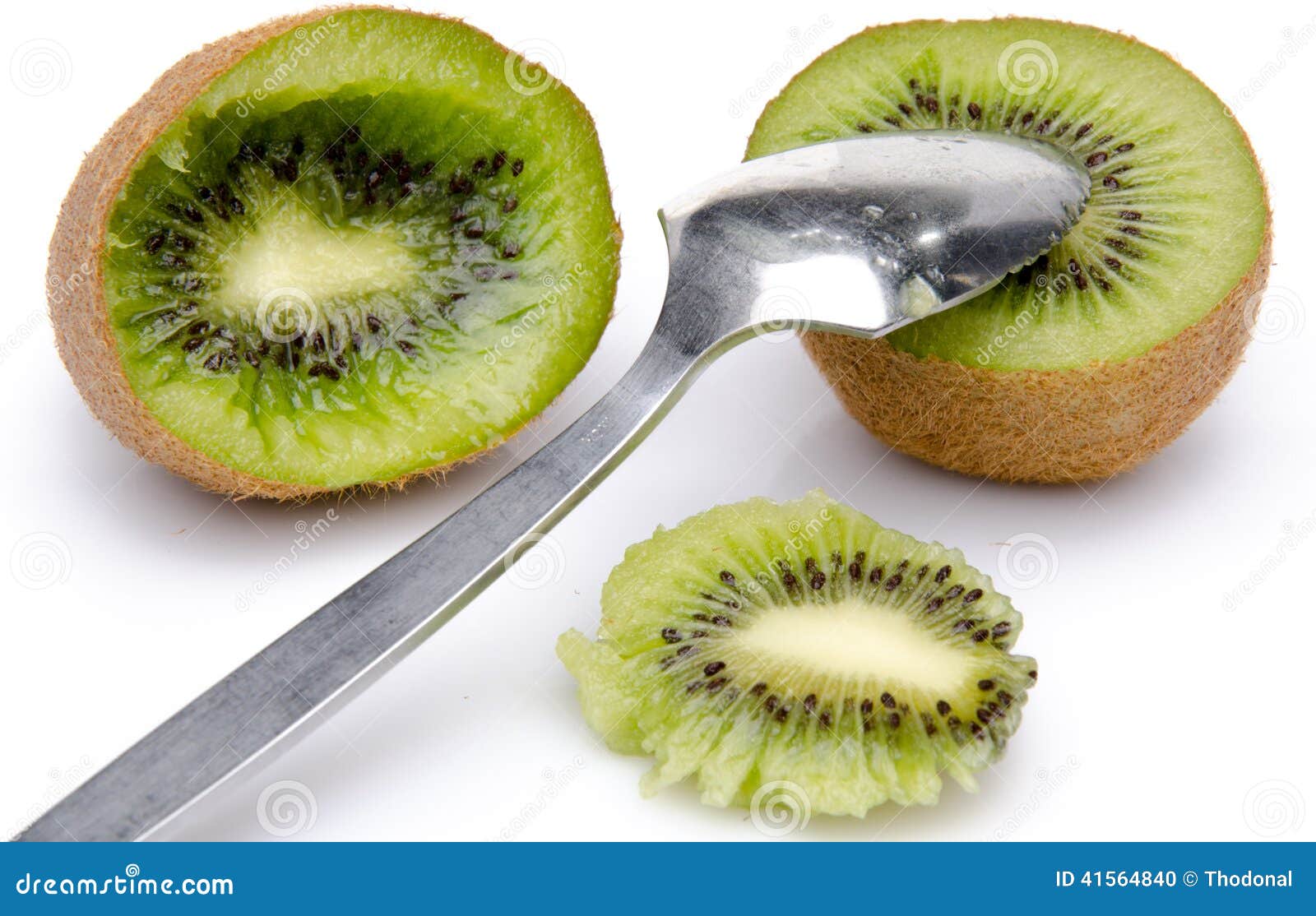 Kiwi Cut in Half with a Spoon Stock Photo - Image of spoon, isolated ...