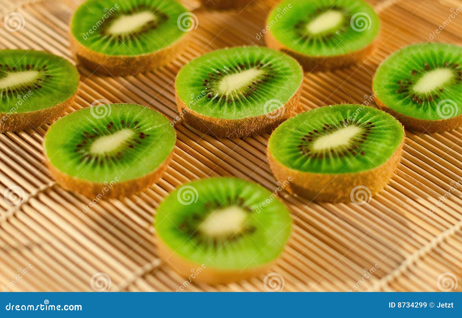 Kiwi Slices on a Bamboo Mat, Shallow Focus Stock Image - Image of ...