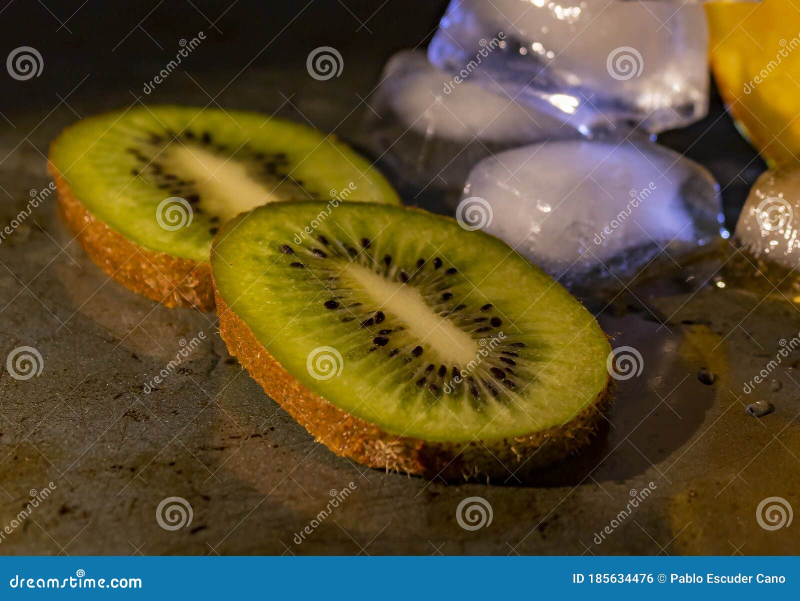 Kiwi Slices and Ice Blocks with Black Background Stock Photo - Image of ...