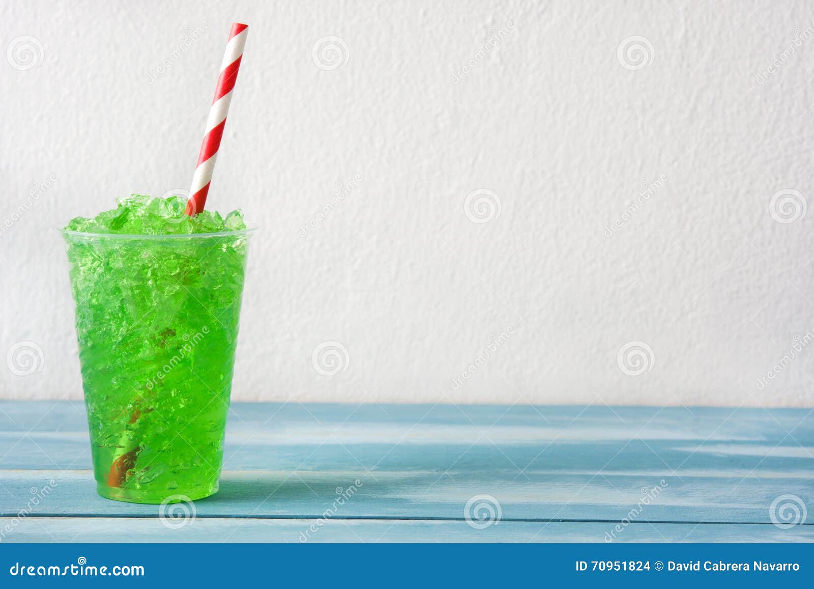Green Slushie And Blue Background Stock Photo | CartoonDealer.com #71006556