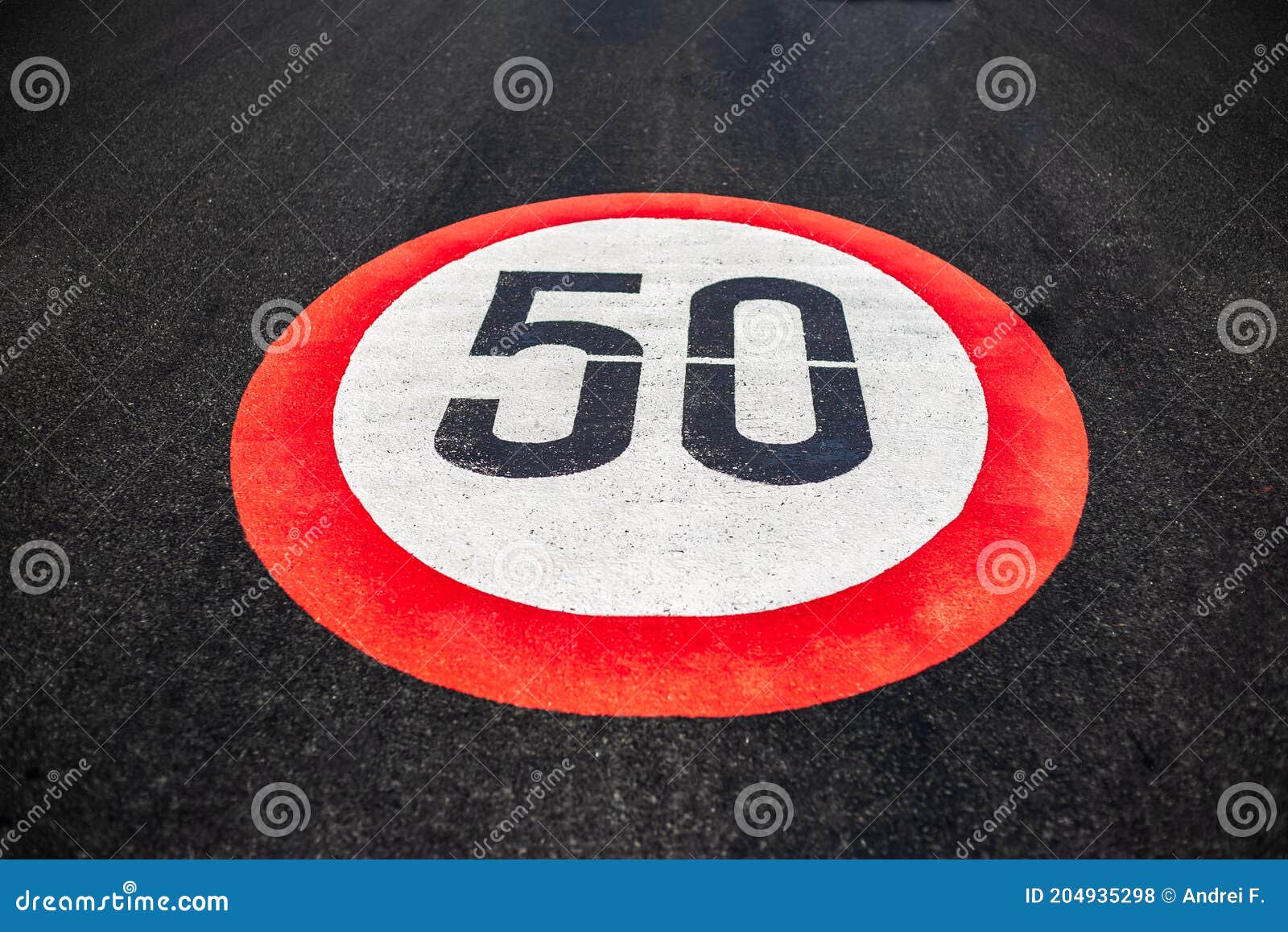 50km/h Speed Limit Sign Painted On Asphalting Road. Royalty-Free Stock ...