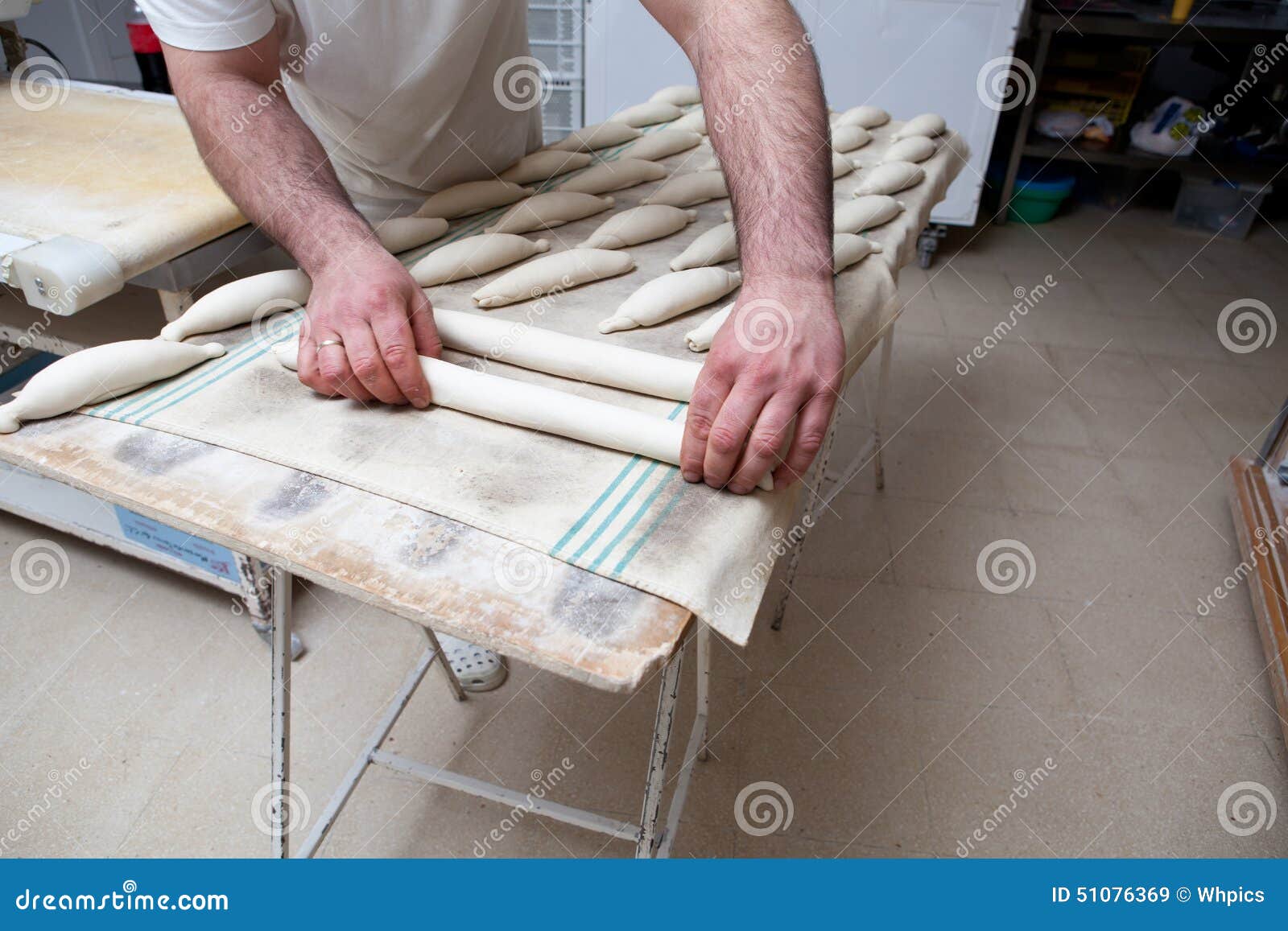 Kneading and Placing Pieces of Bread Over Fermentation Table Stock ...