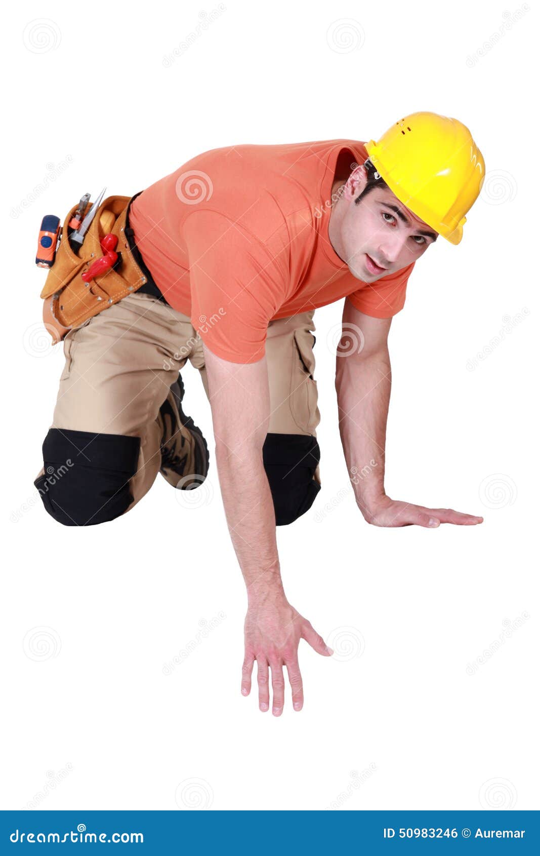 Kneeling Tradesman Reaching Down Stock Photo - Image of safety ...