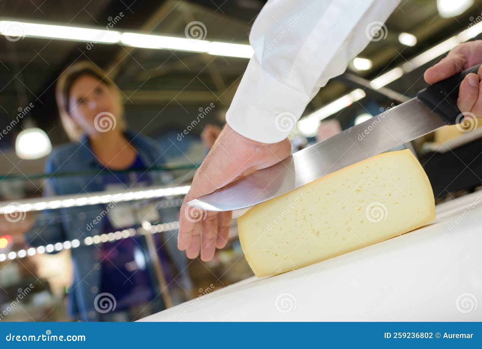 Knife Cutting through Cheese for Customer Stock Photo - Image of ...