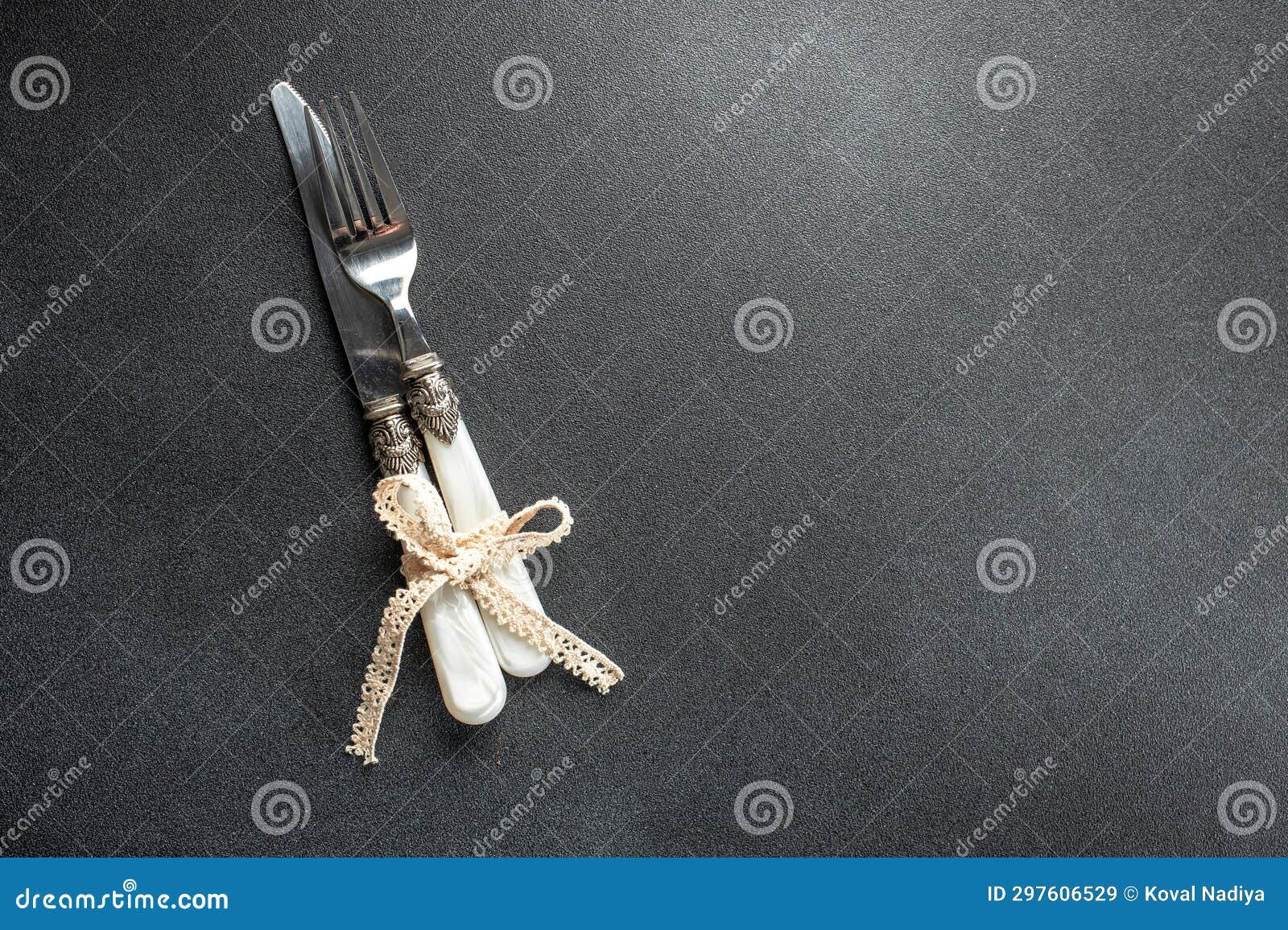 Knife and Fork Tied Up with String, Table Setting Dark Background. Top ...