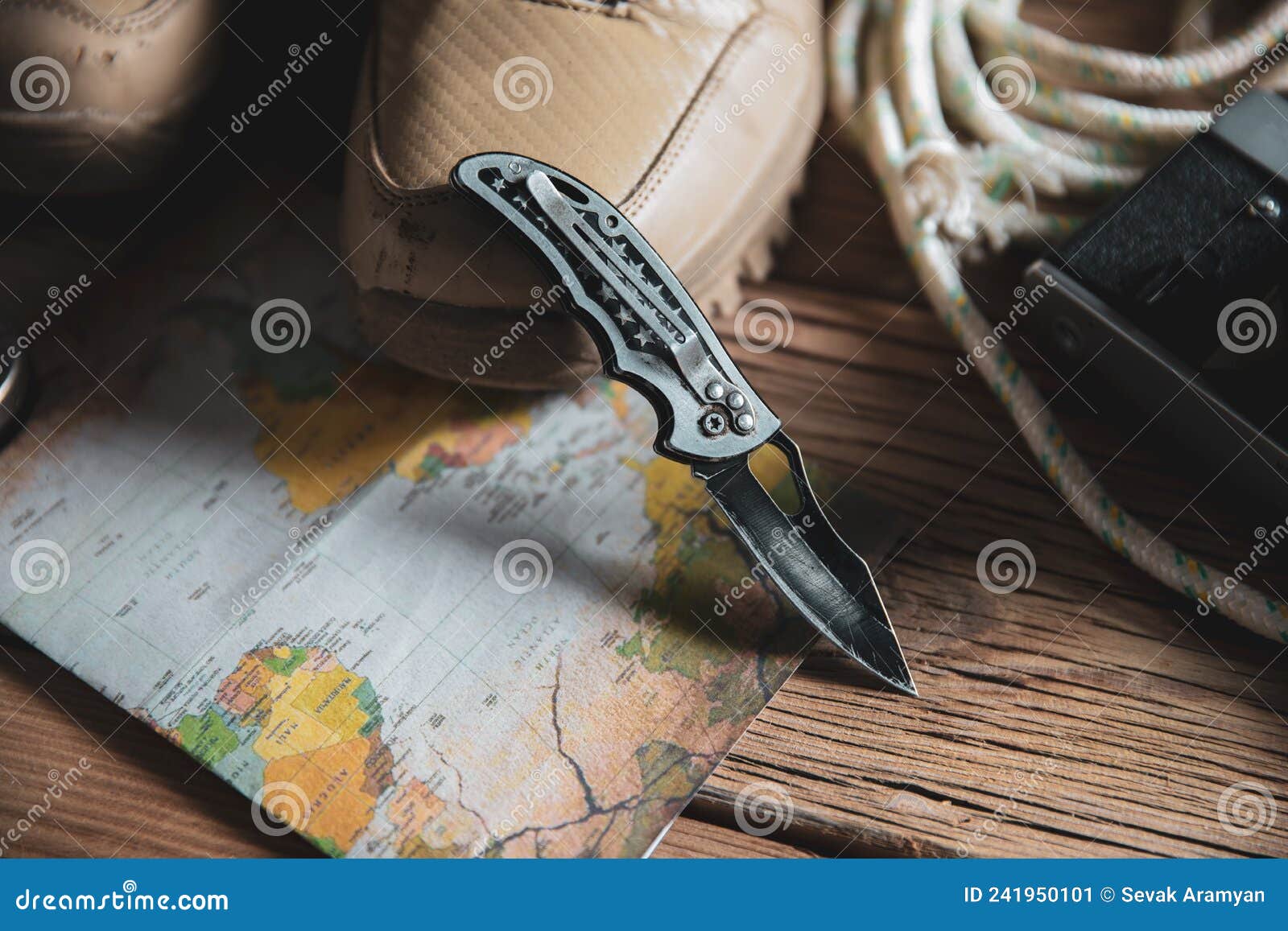 Knife on map on the desk. stock image. Image of cartography - 241950101