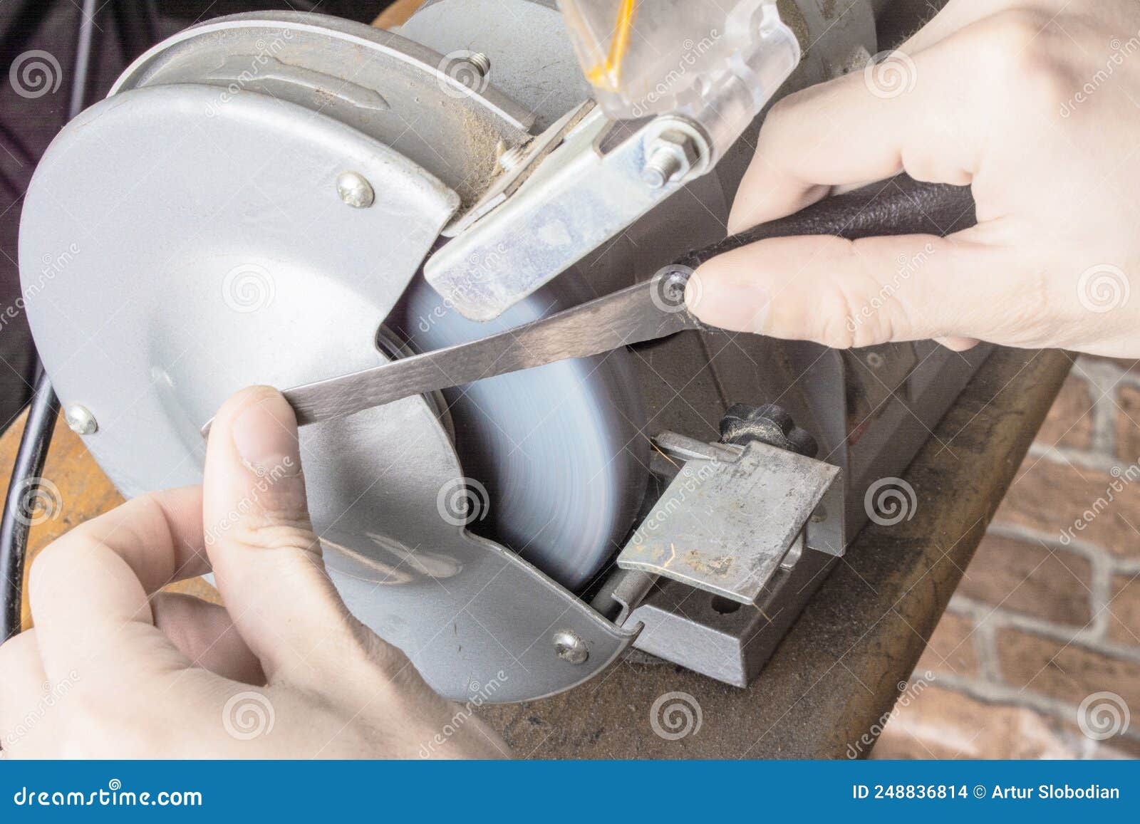 Knife Sharpener and Hand with Blade on Table, Closeup Stock Photo ...