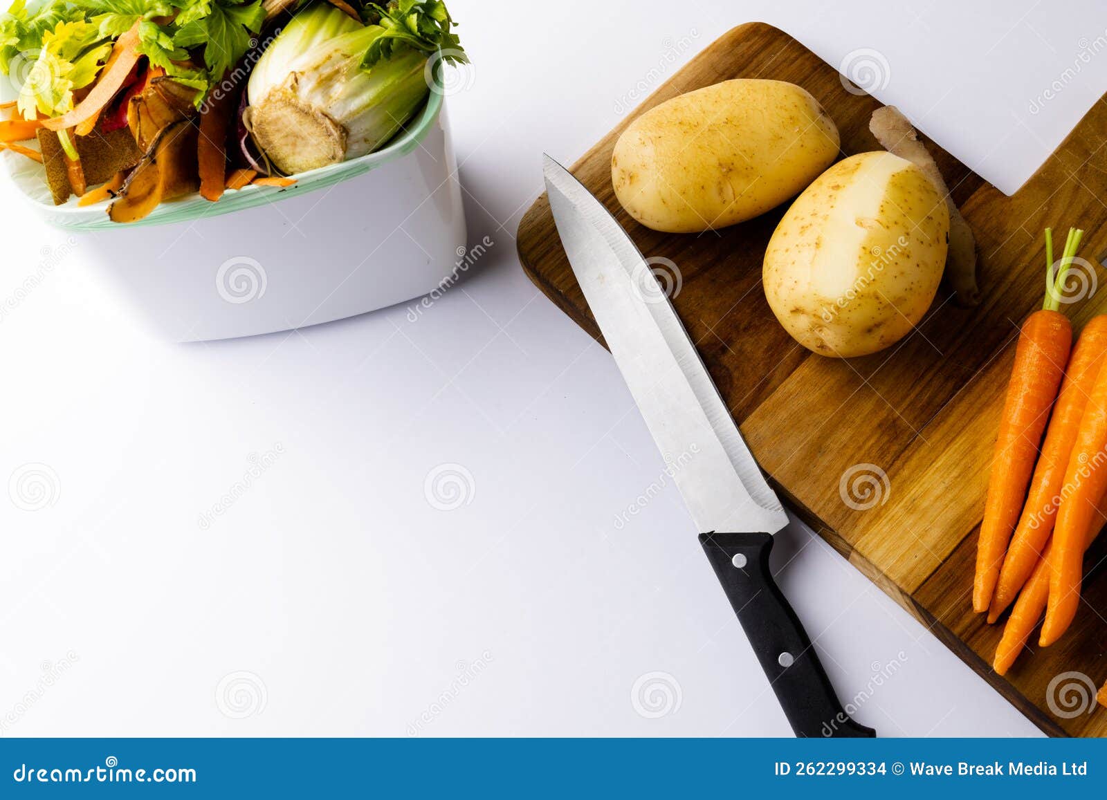 Knife and Vegetables on Chopping Board with Vegetable Waste in Kitchen ...