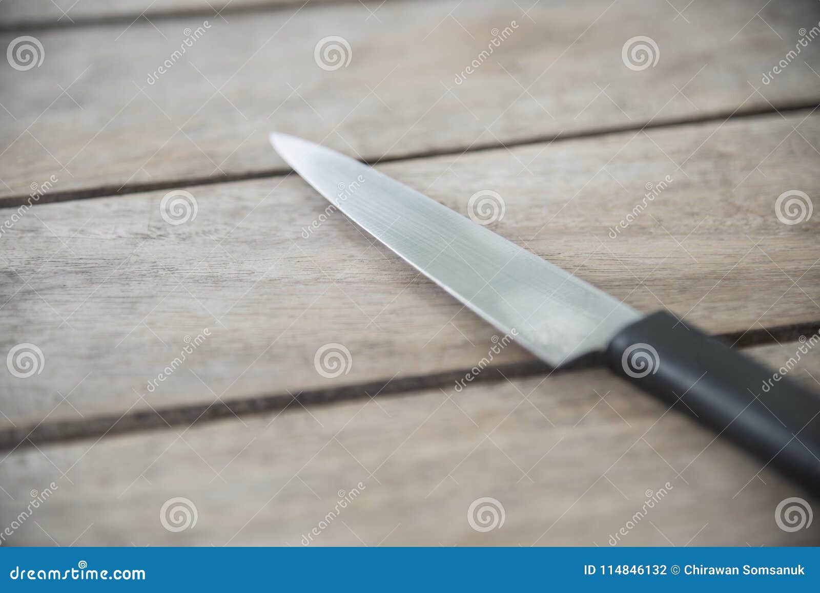 Knife on wood table. stock photo. Image of stainless - 114846132
