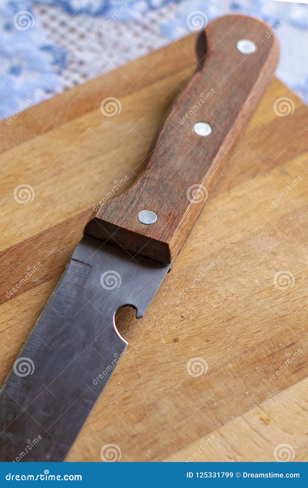 Knife with a Wooden Handle on a Rustic Kitchen Cutting Board Stock ...