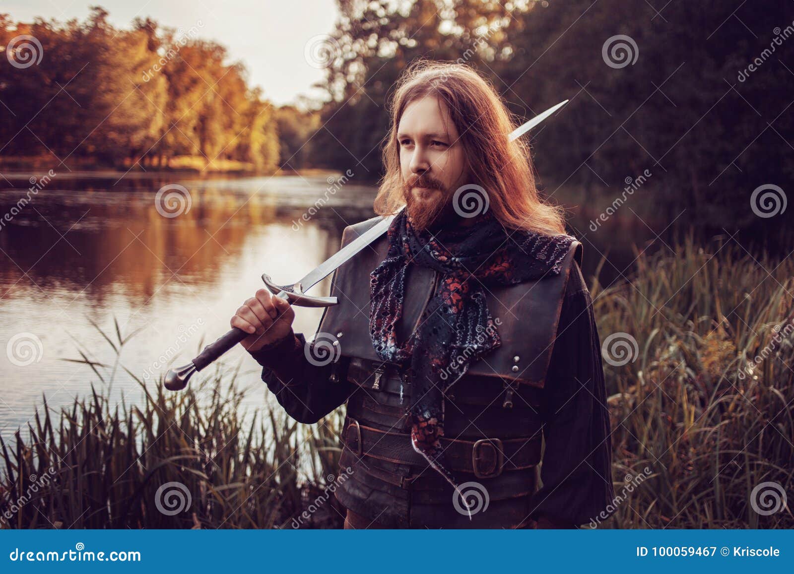 Knight in the Forest. a Guy in Medieval Costume with a Sword Stock ...