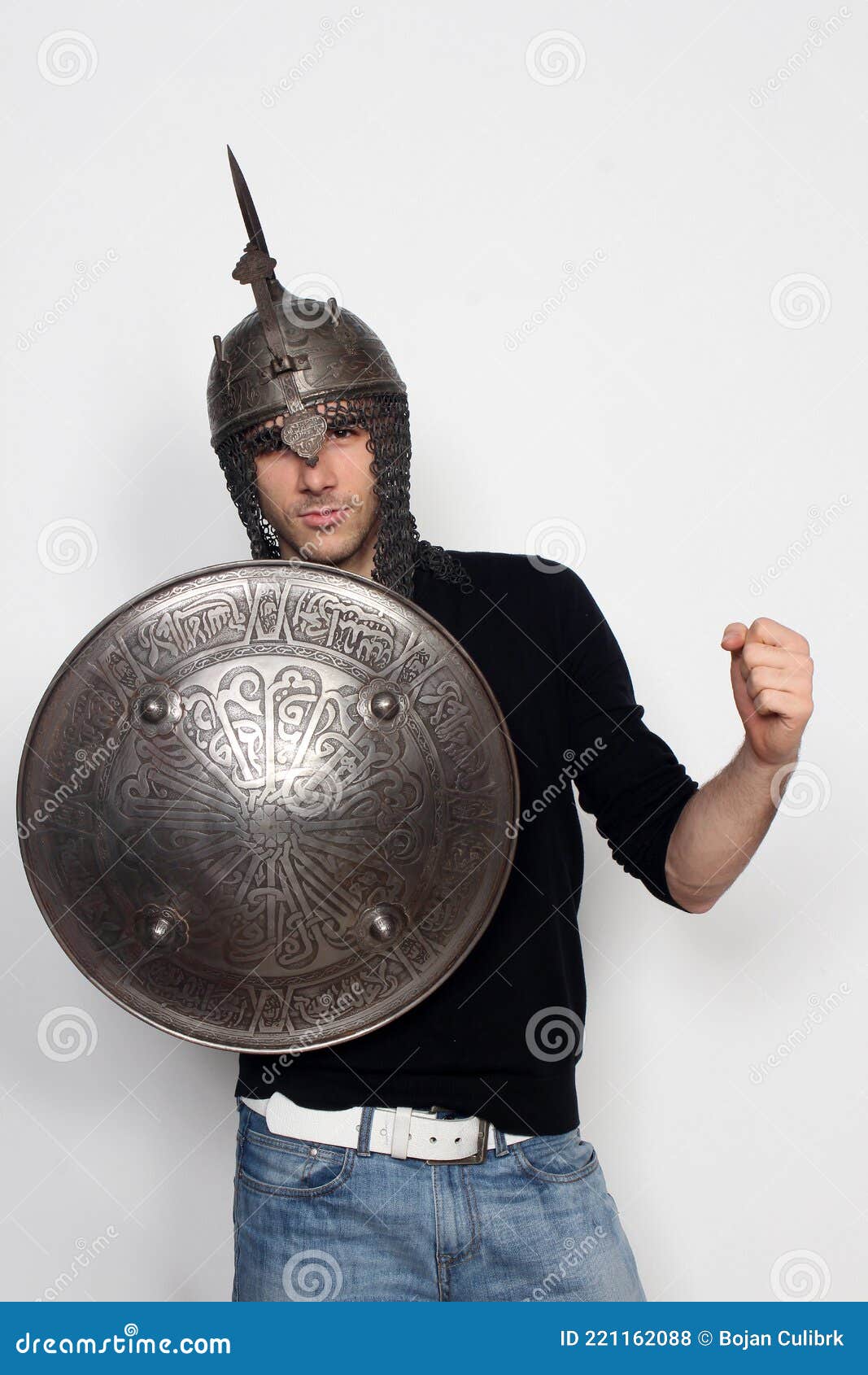 Young Guy is Posing in Studio with Helmet and Shield. Knight, Halloween ...