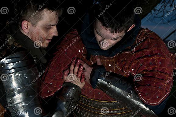 Knight Help Another Wounded Knight Stock Photo - Image of metallic ...