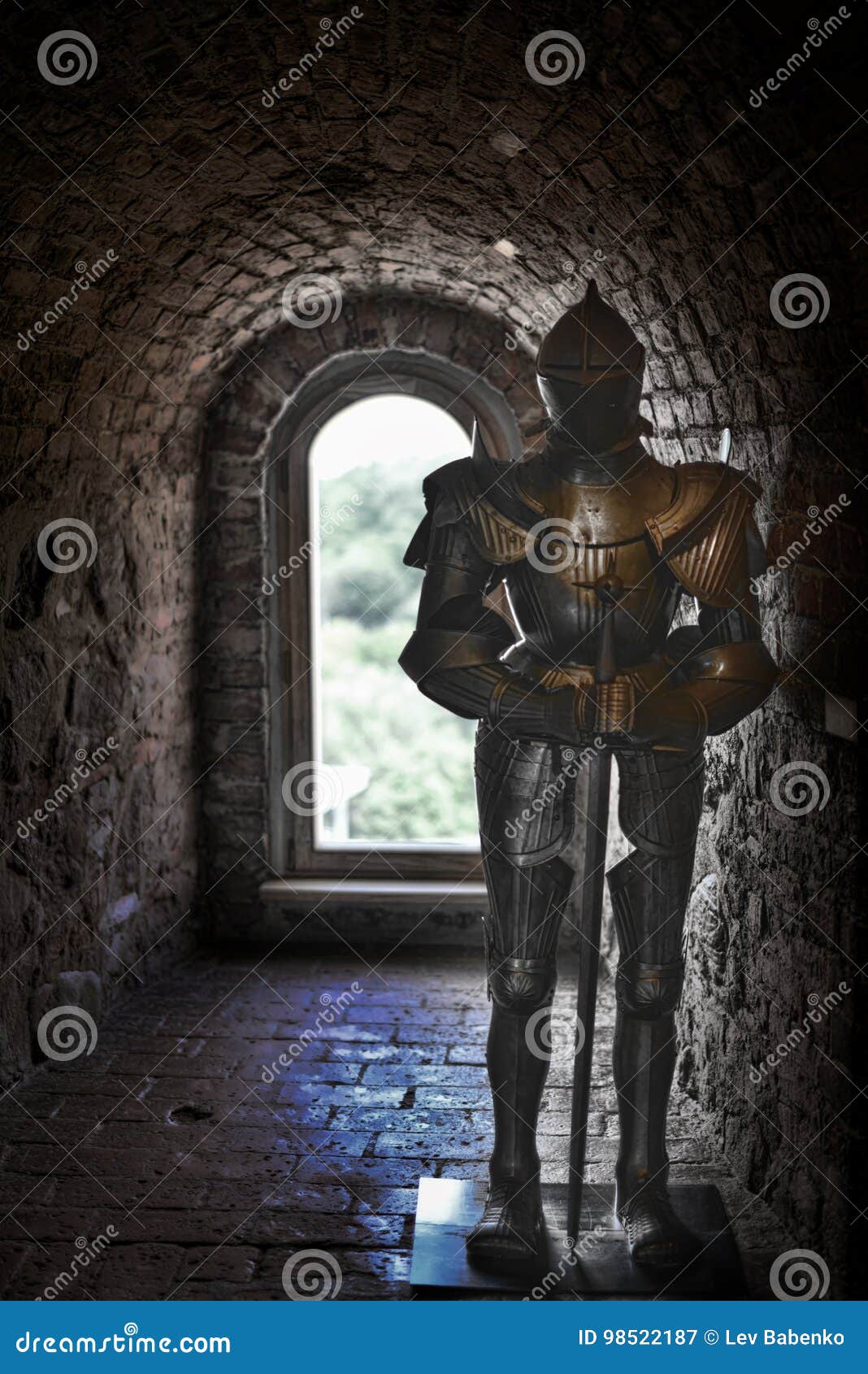 Knight`s Armor Against the Backdrop of the Brick Walls of an Ancient ...