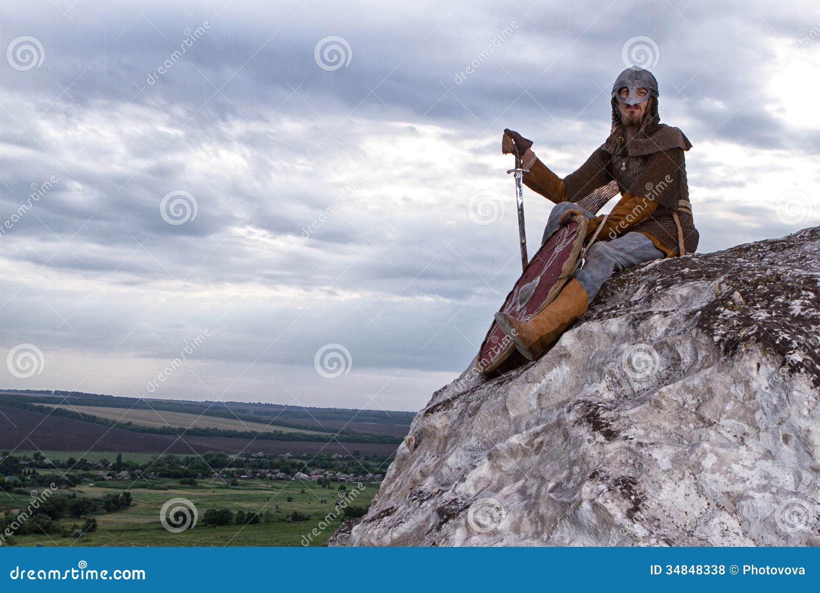 Knight sitting on a rock stock photo. Image of armed - 34848338