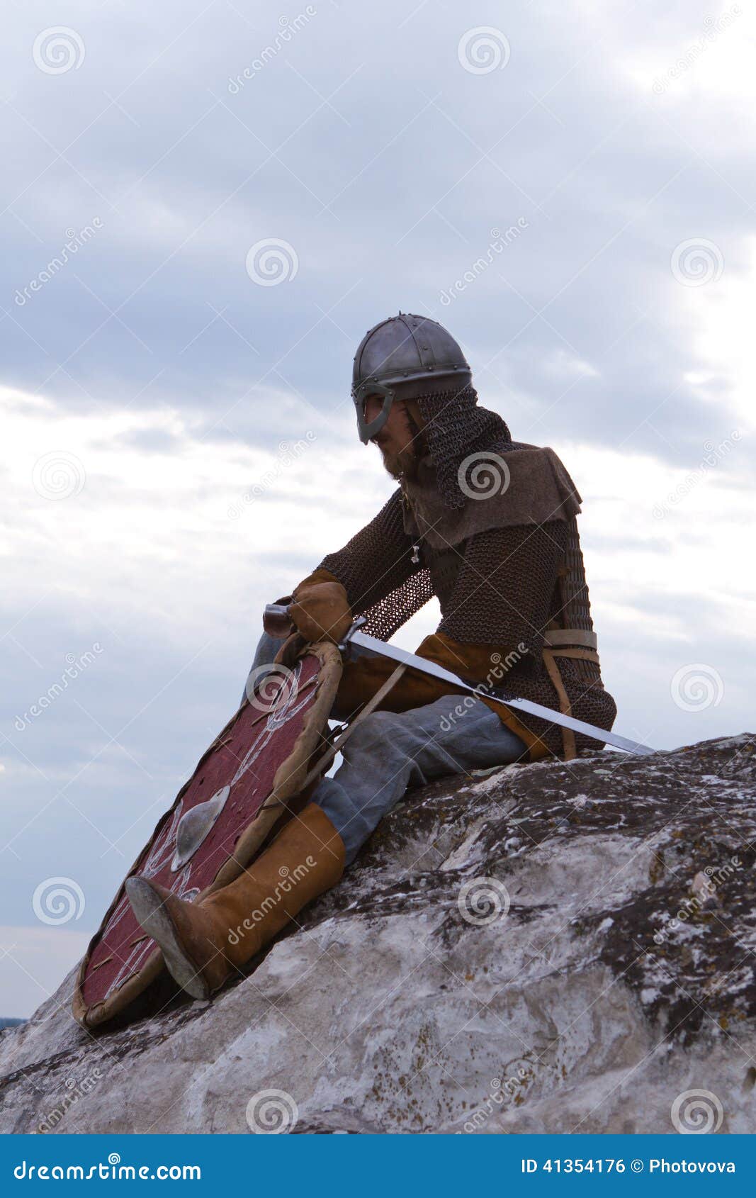 Knight sitting on a rock stock photo. Image of european - 41354176