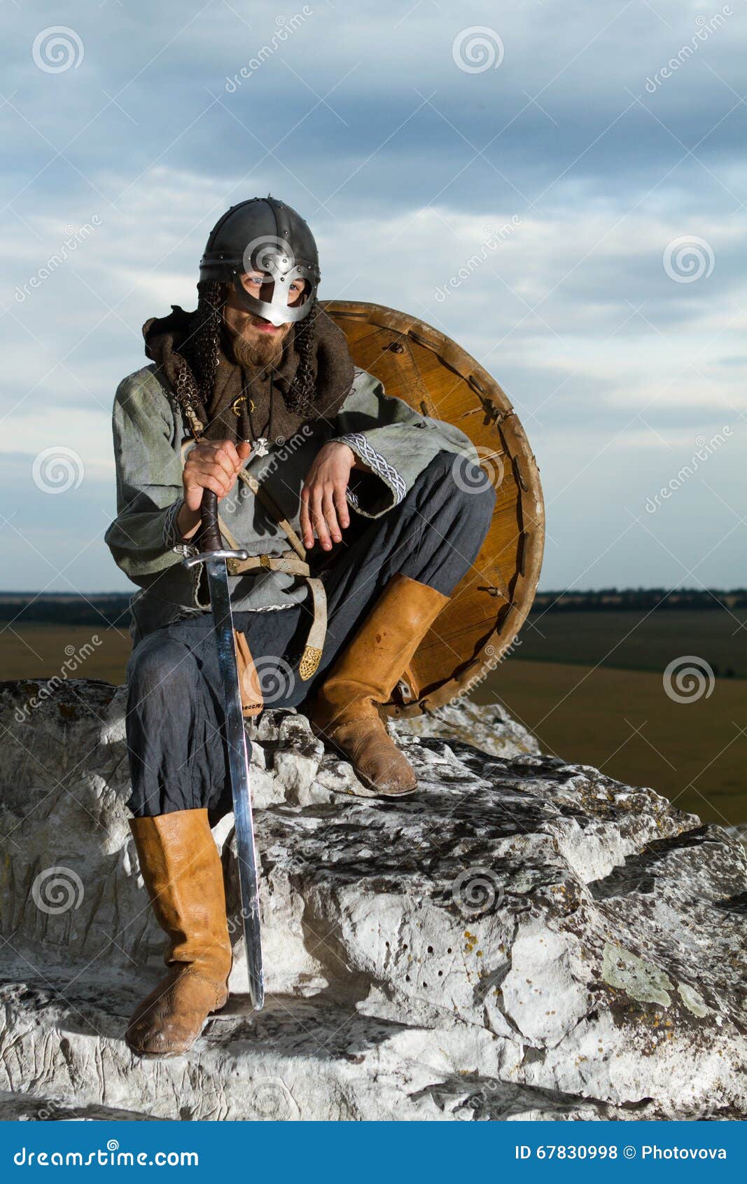 Knight Sitting on a Rock with a Sword Stock Photo - Image of history ...