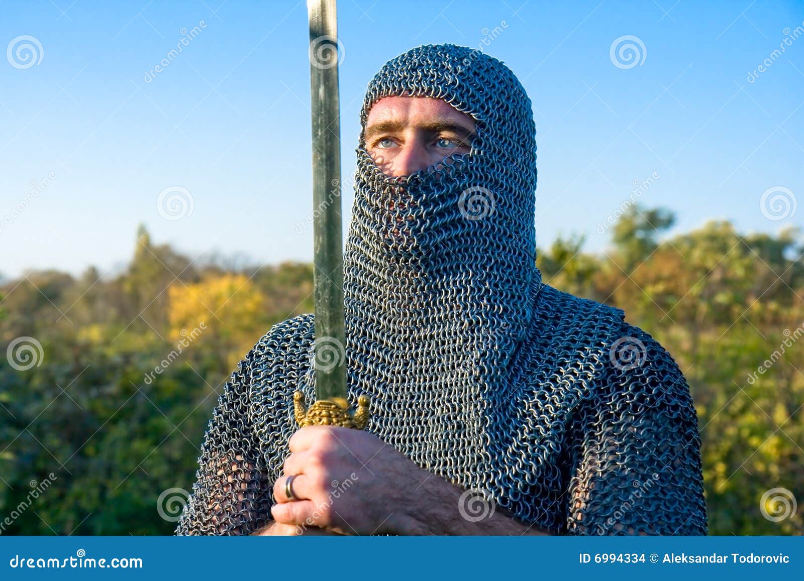 Knight Wearing Armour and Hold on a Sword Stock Photo - Image of plate ...