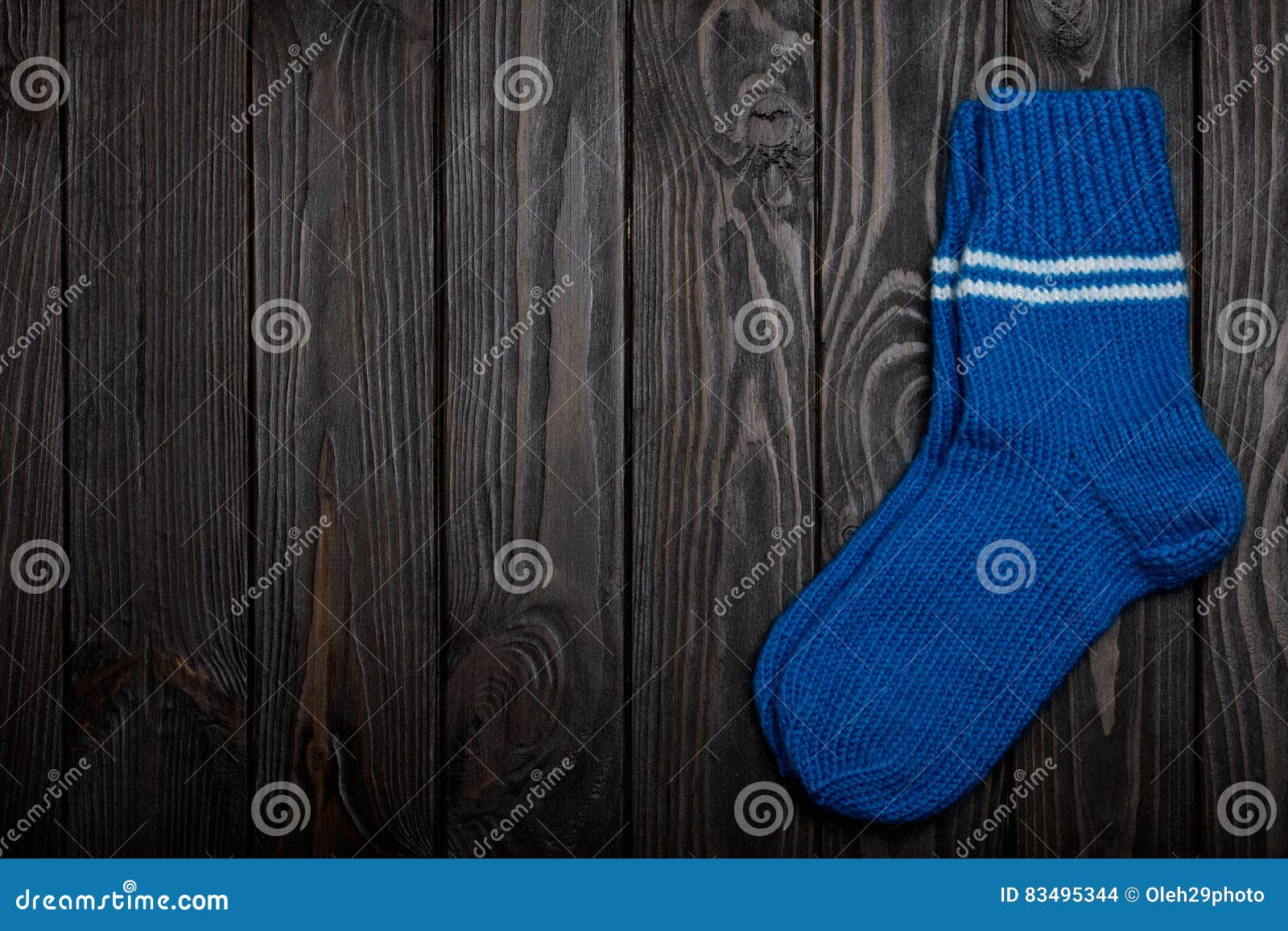 Knit Blue Wool Socks on Dark Wooden Background. Stock Photo - Image of ...