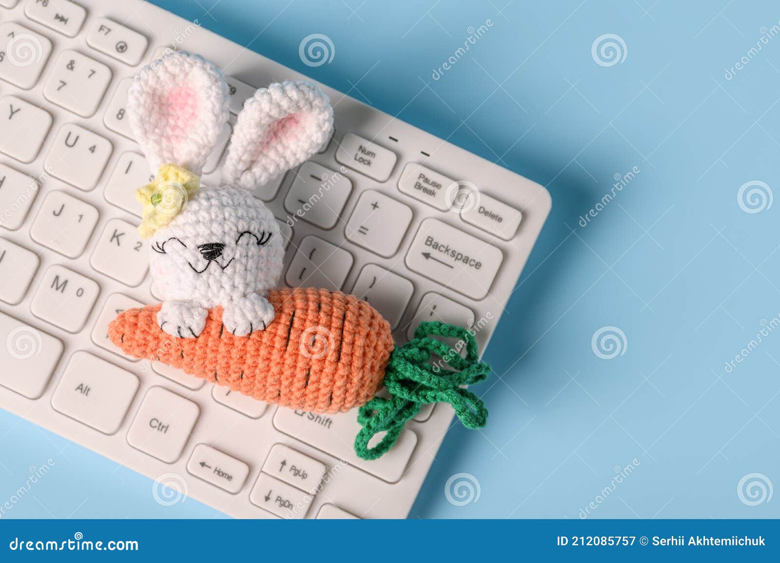 . Knitted Easter Bunny on a Blue Background with a Keyboard. Happy ...