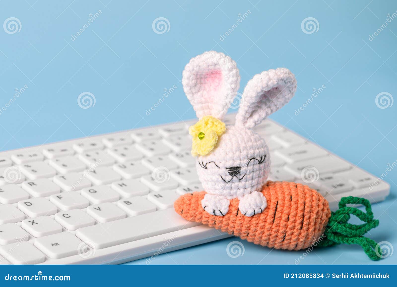 . Knitted Easter Bunny on a Blue Background with a Keyboard. Happy ...