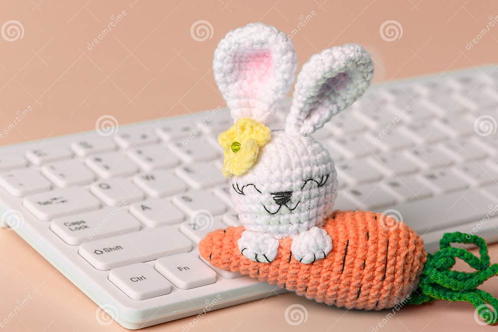 . Knitted Easter Bunny on a Blue Background with a Keyboard. Happy ...