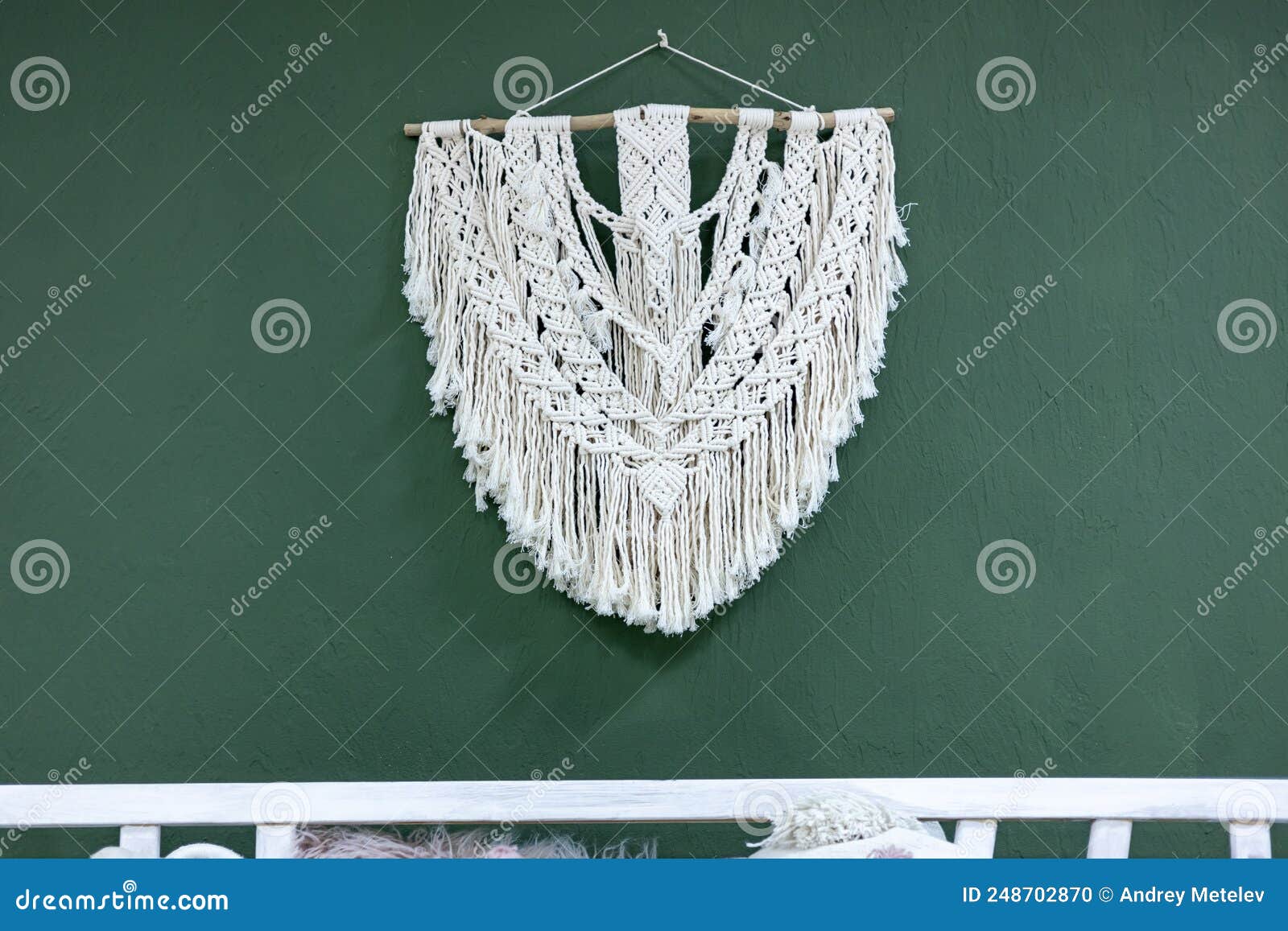 Knitted Hanging Structure on the Green Wall Above the Bed Stock Photo ...