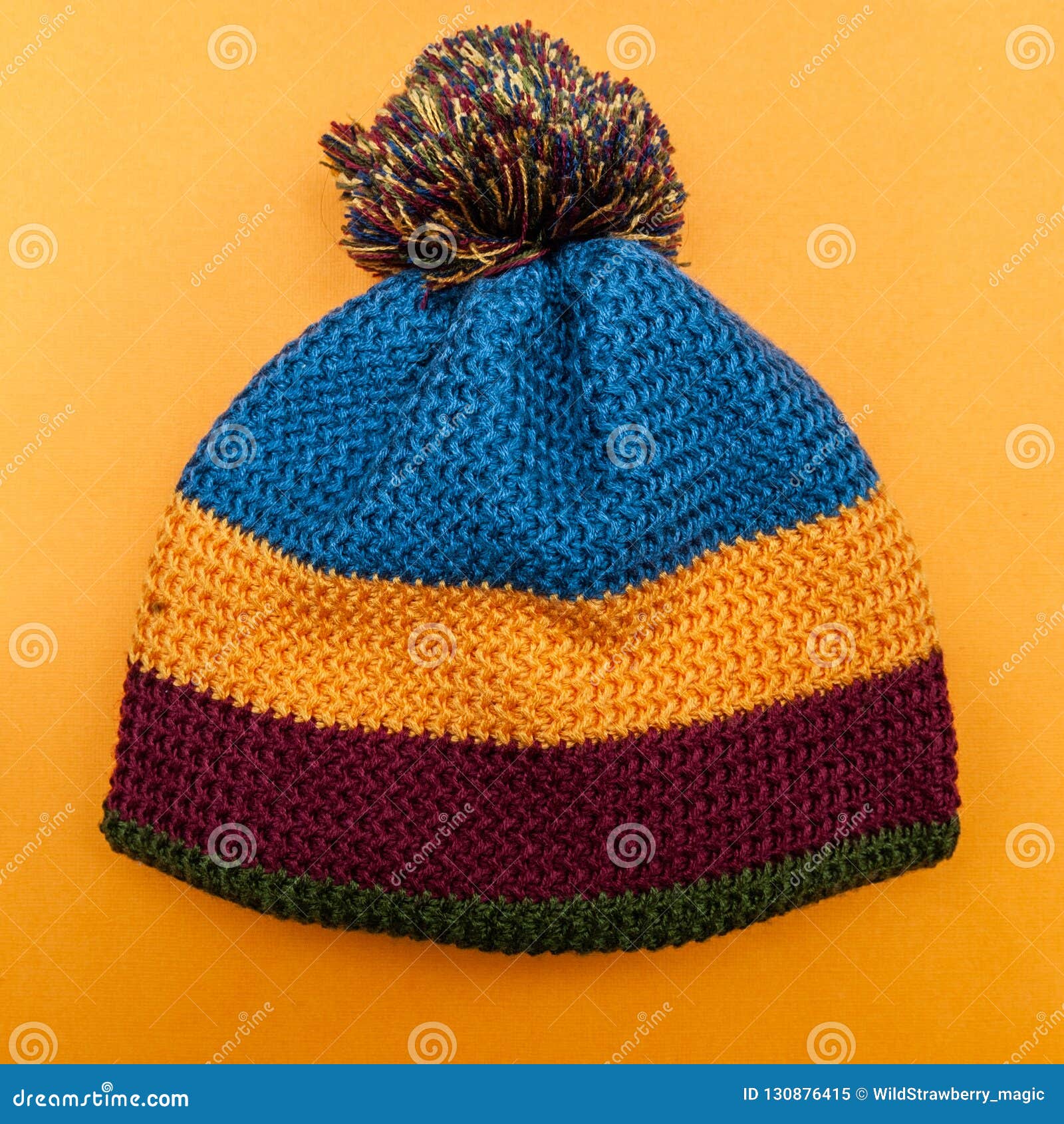 Knitted Multicolored Hat on a Simple Background. Stock Image - Image of ...