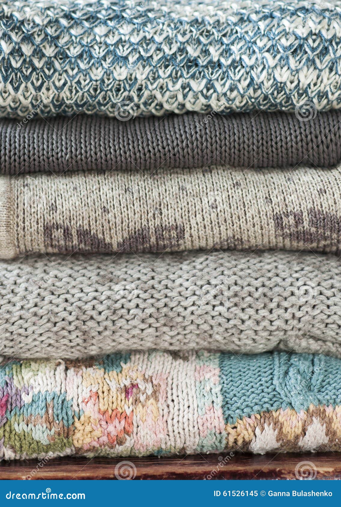 Knitted sweaters stacked stock image. Image of fabric - 61526145