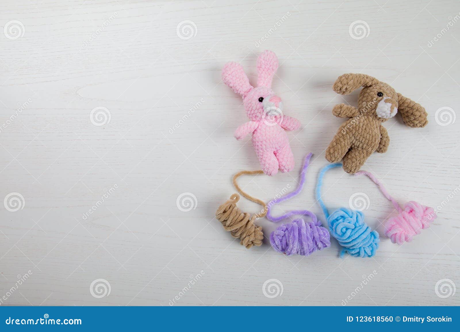 Knitted Toys - a Rabbit and a Dog are Lying on the Board. Colored ...
