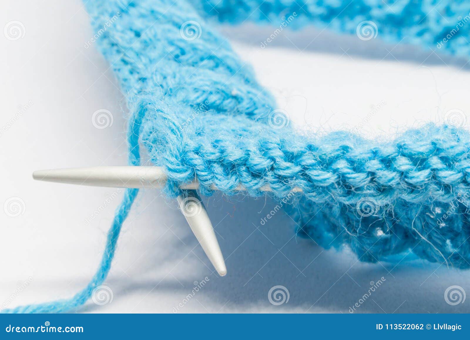 Knitting with a blue wool stock photo. Image of knitting - 113522062