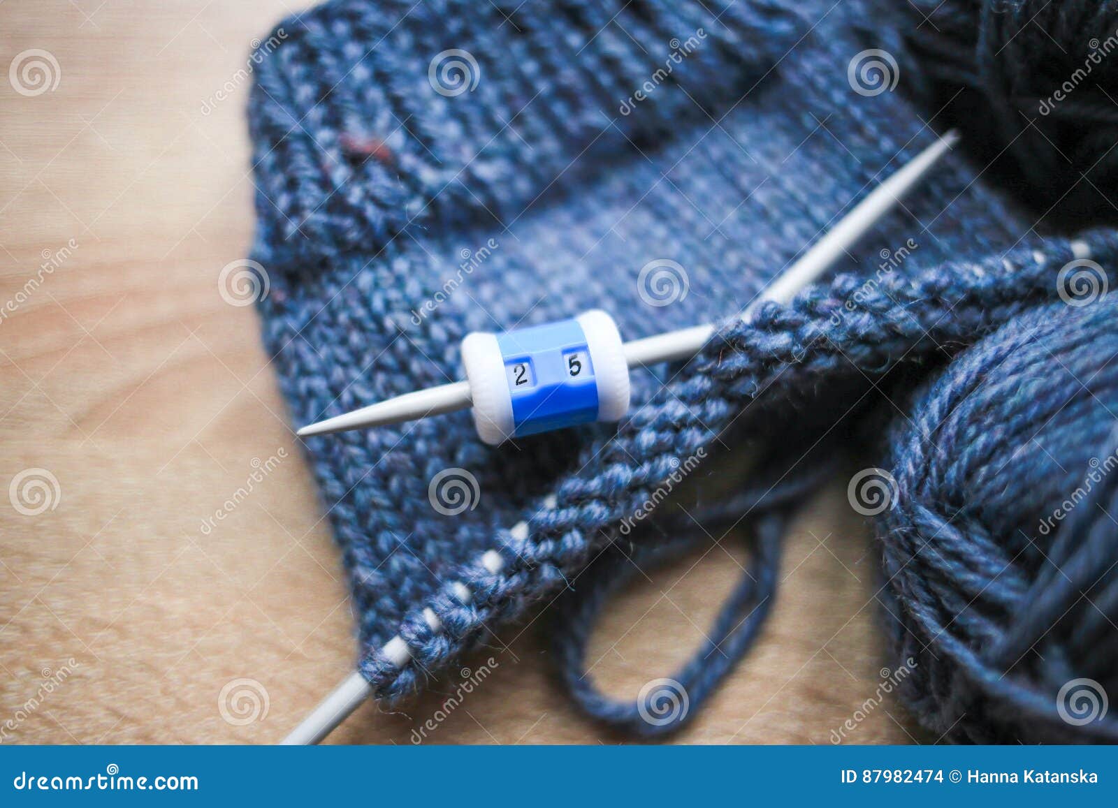 Knitting Needles, Loop Counter and Blue Yarn are on the Table Stock ...