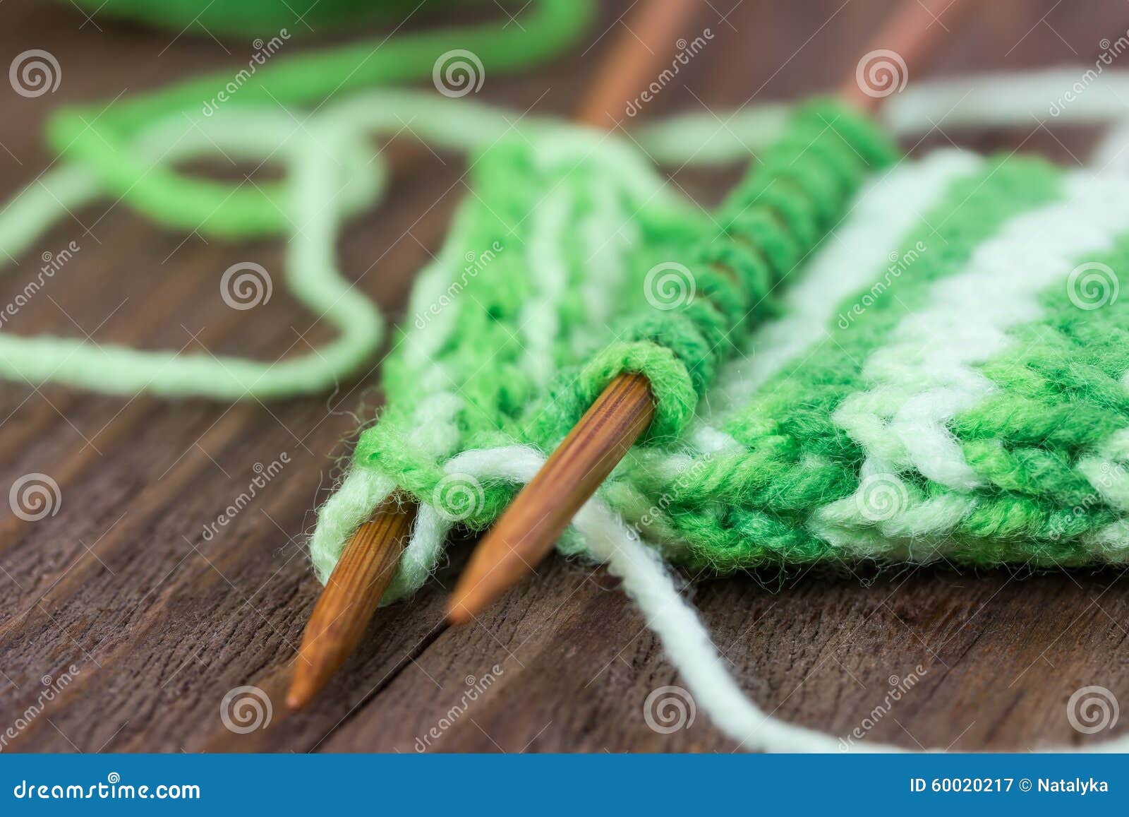 Knitting Pattern of Green Yarn on Wooden Needles Stock Image - Image of ...