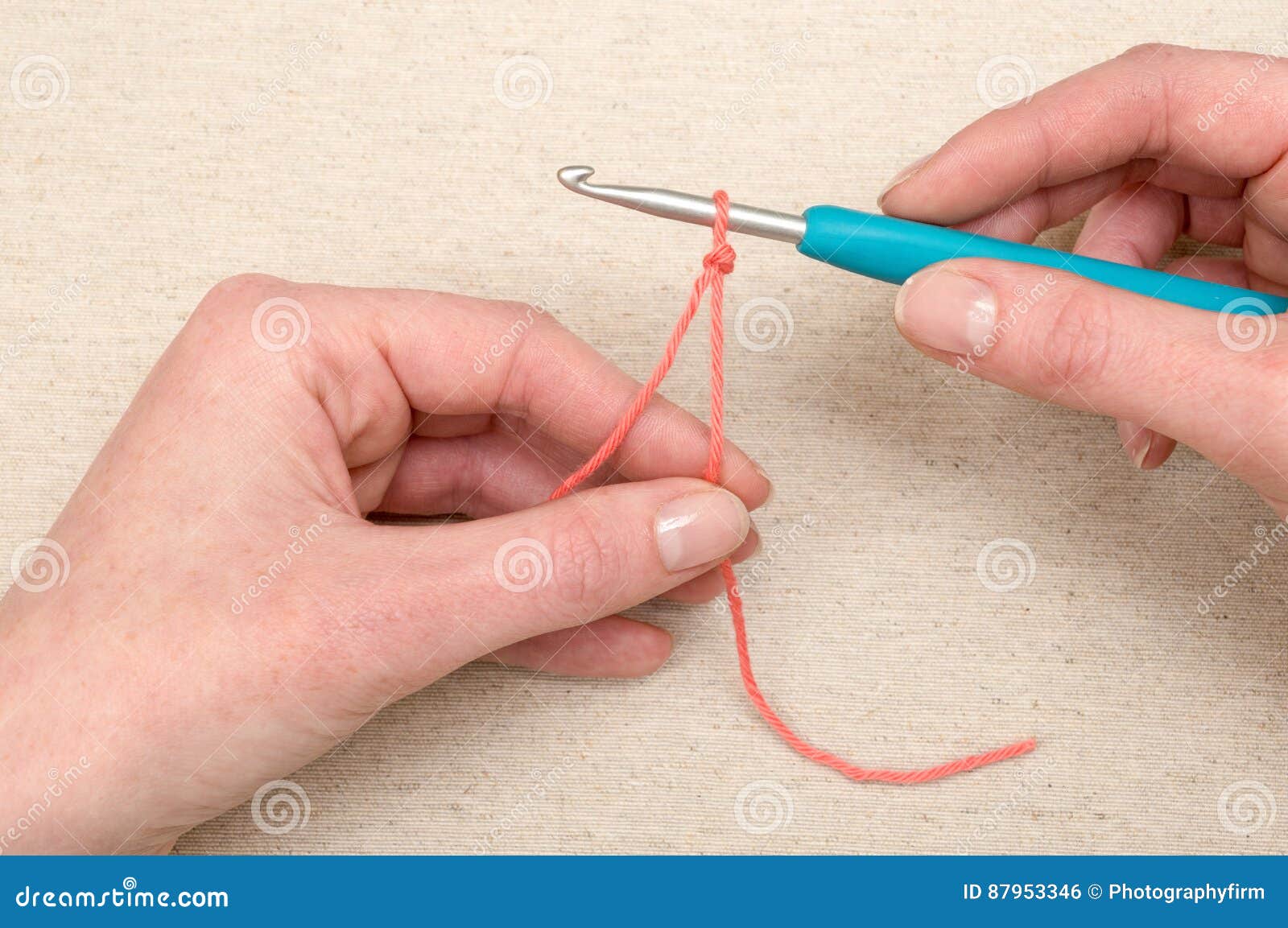 Knitting a Strand of Orange Yarn with Crochet Hook Stock Photo - Image ...