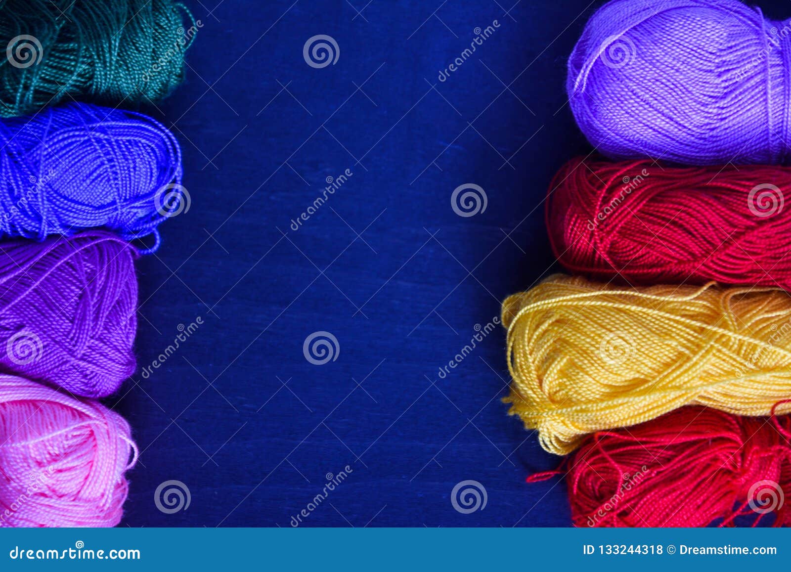 Knitting Threads on a Blue Background Stock Photo - Image of color ...