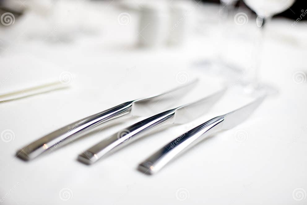 Knives at a table setting stock photo. Image of shiny - 13680108