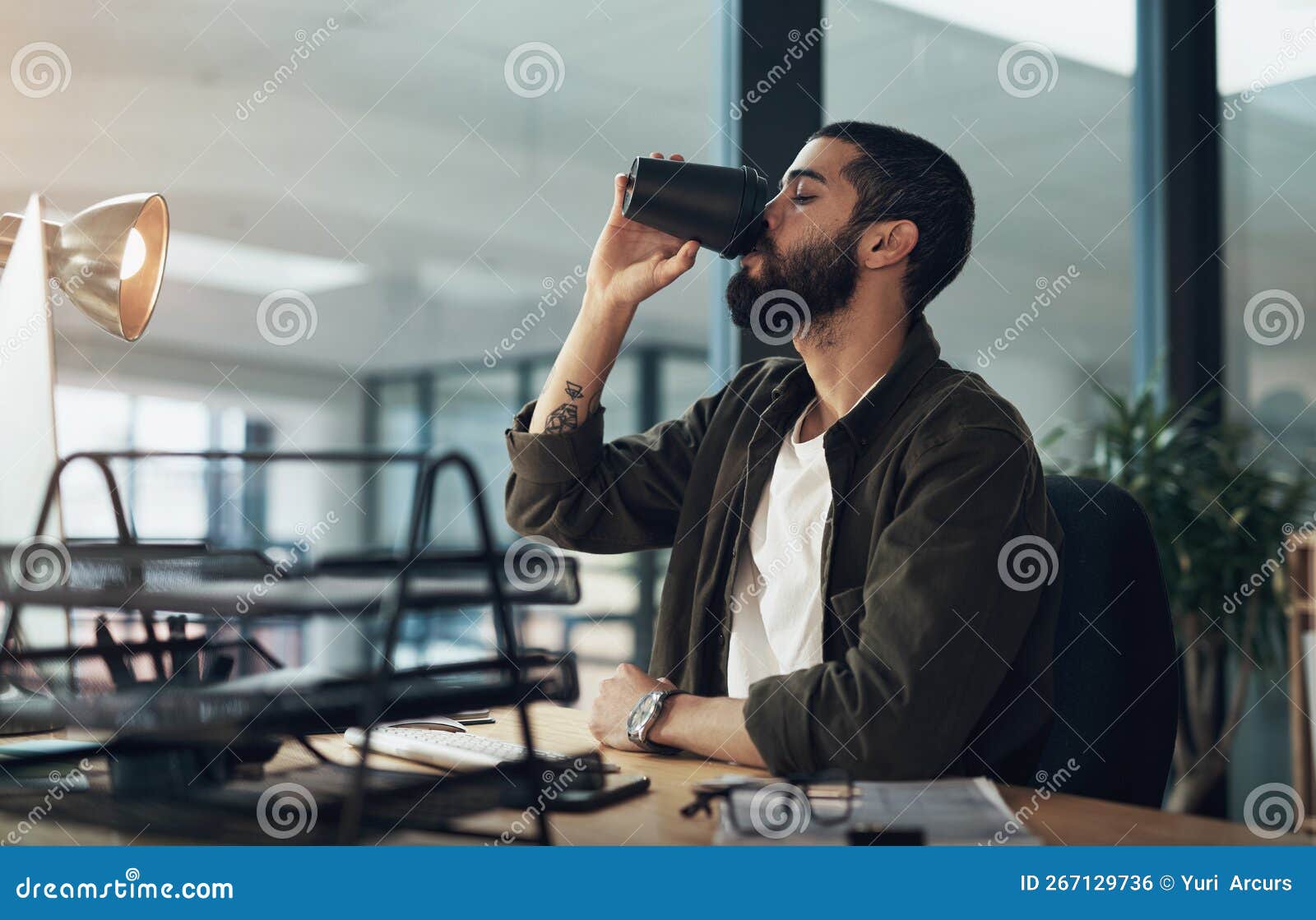 Knocking Back the Coffee To Beat the Clock. a Young Businessman Having ...