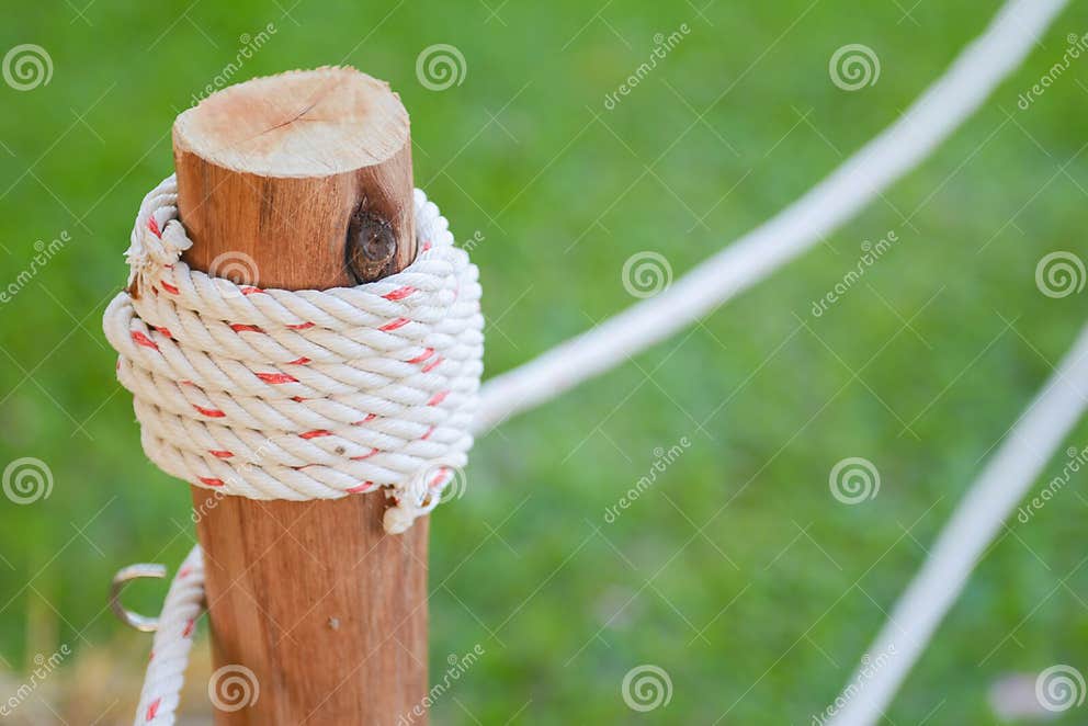 Knot by rope on wood pole stock photo. Image of string - 47398528