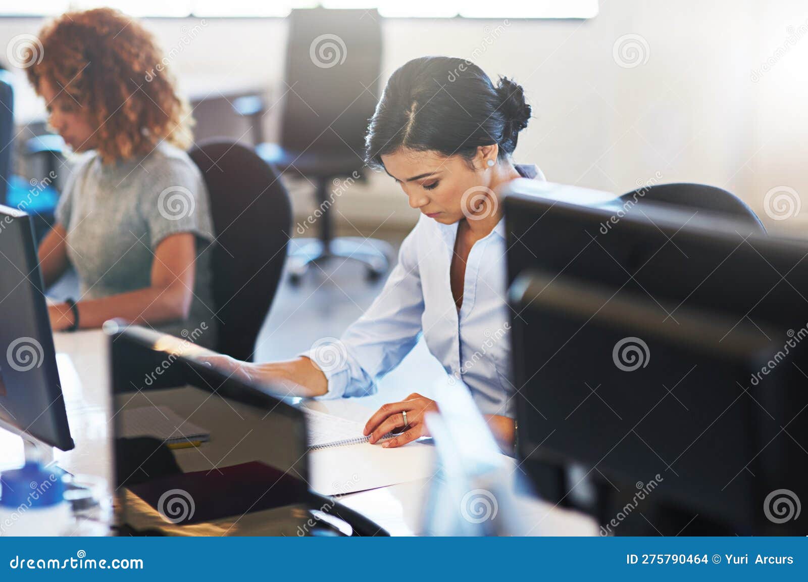 They Know the Importance of Hard Work. Young Businesswomen Working in ...