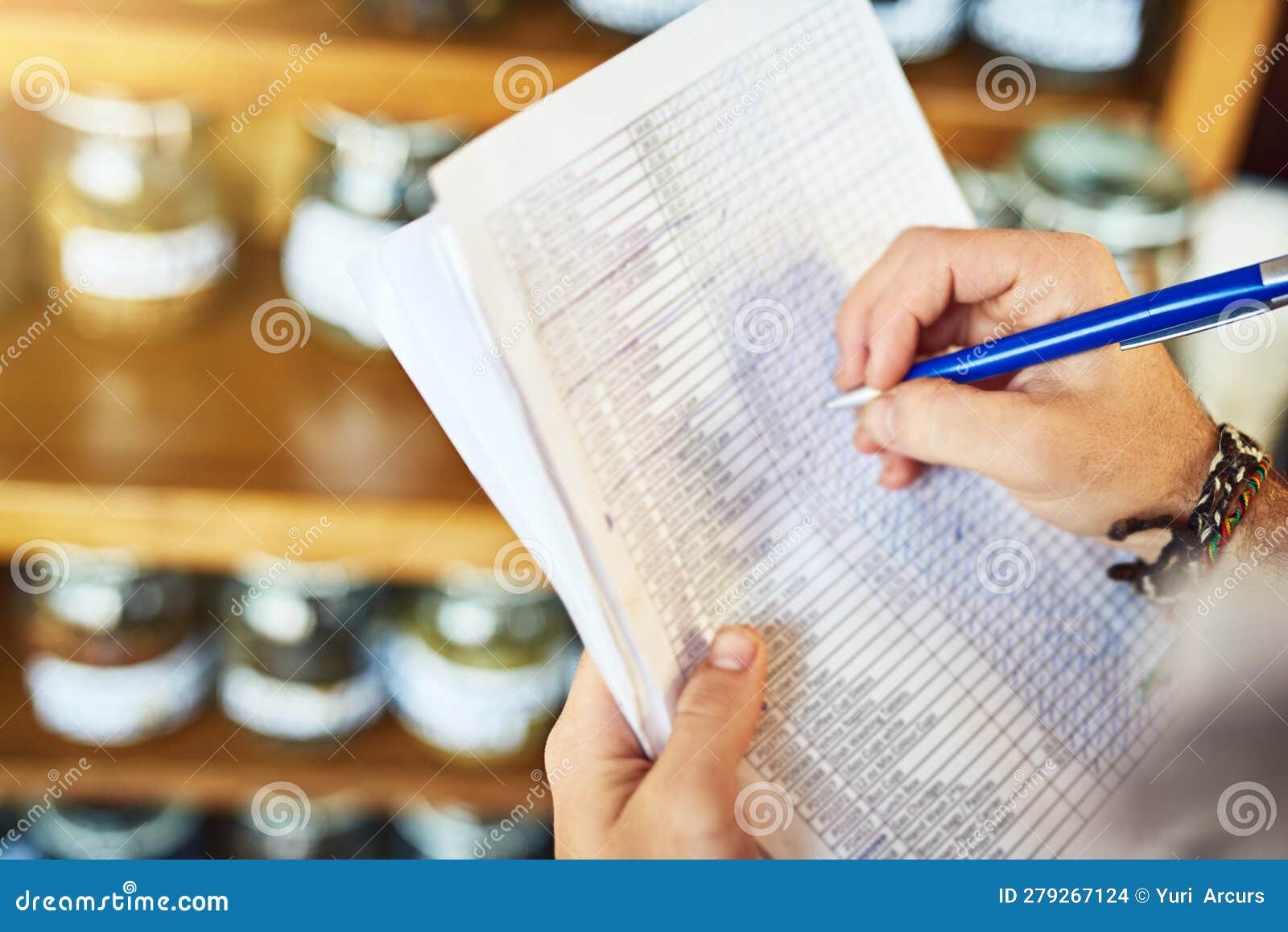 Know the Value of Your Inventory. a Shop Owner Doing Some Paperwork ...
