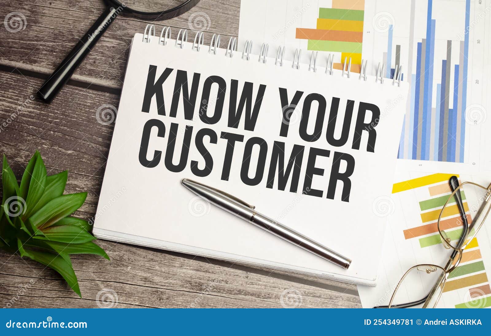 Know Your Customer Words on Notepad with Magnifying Glass and Charts ... Know Your Customer Words on Notepad with Magnifying Glass and Charts ...
