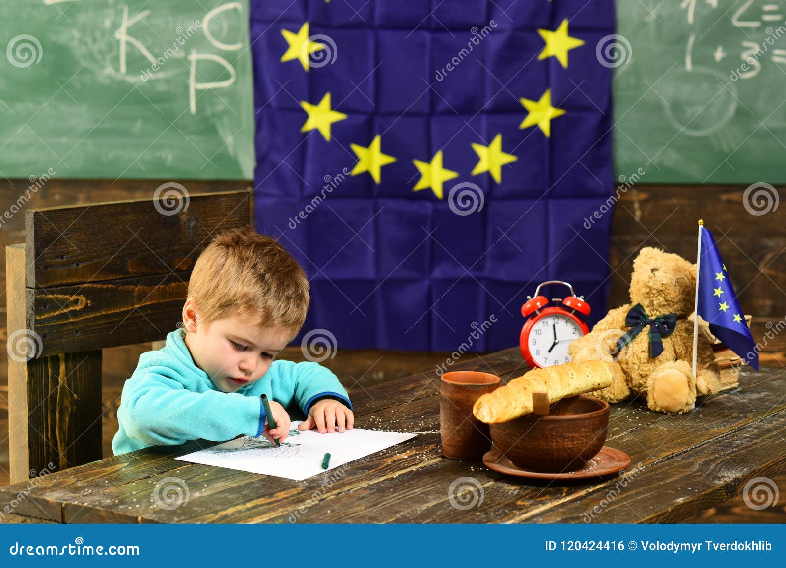 Knowledge Concept. Child Draw at Table with Eu Flag on Class Chalkboard ...