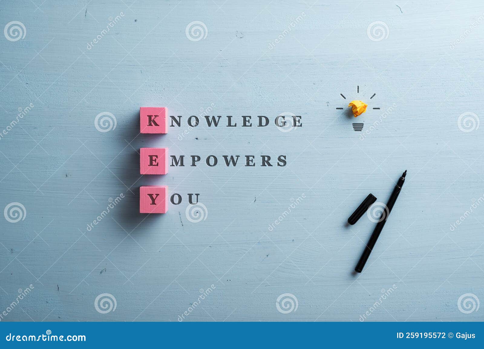 Knowledge Empowers You Sign Written on Blue Wooden Background with the ...