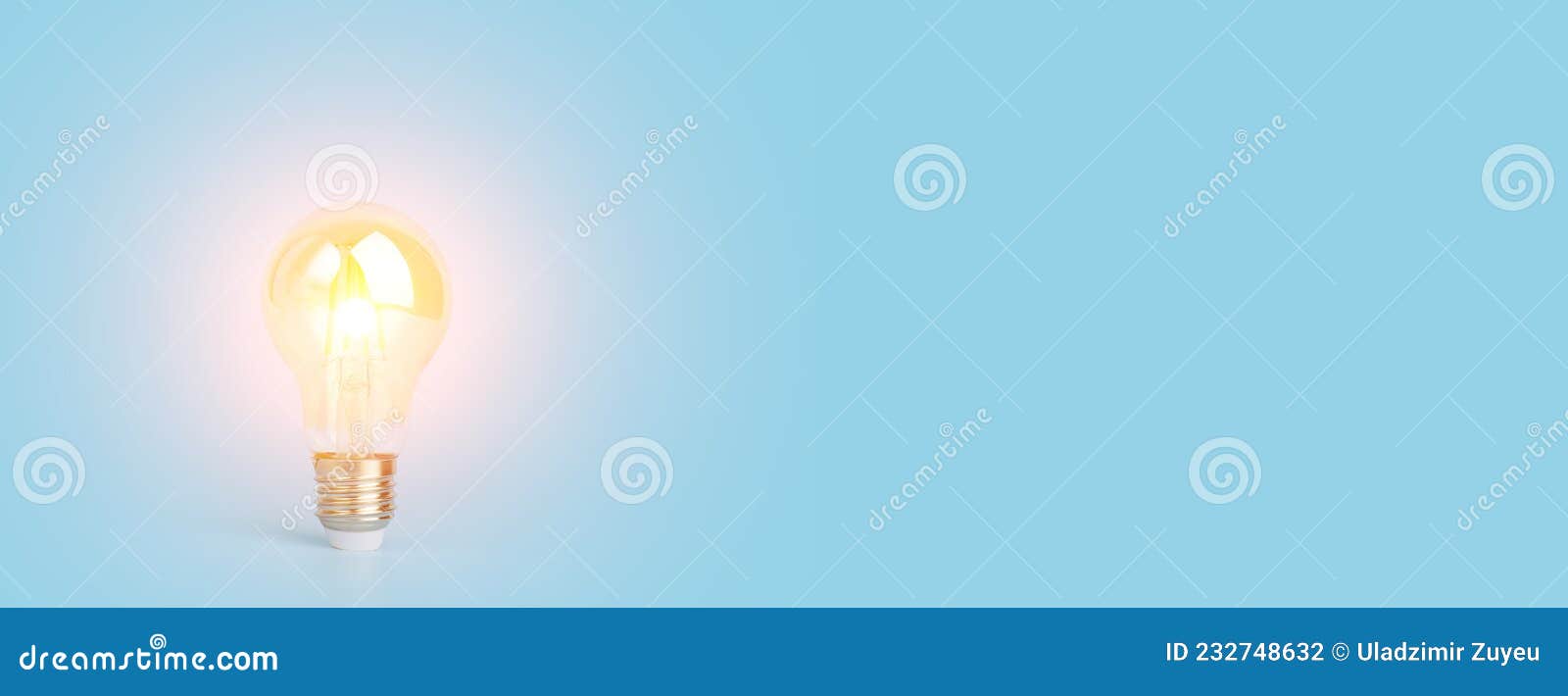 Knowledge and Idea Concept. Light Bulb with Light on a Blank Blue ...