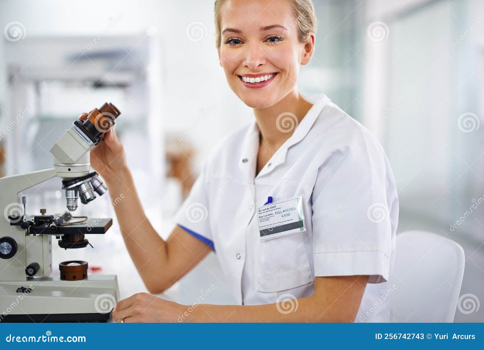 Knowledge is Power. a Beautiful Woman in a Laboratory Working with a ...