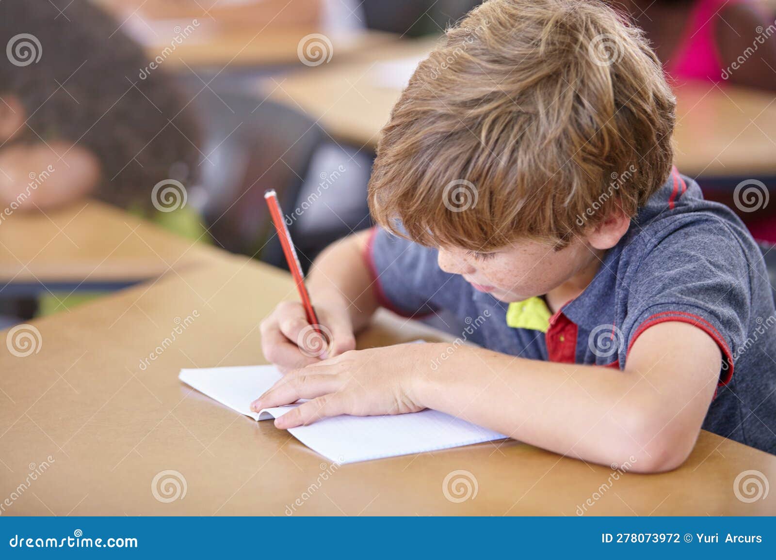 He Knows All the Answers. a Little Boy Doing His Work in Class. Stock ...