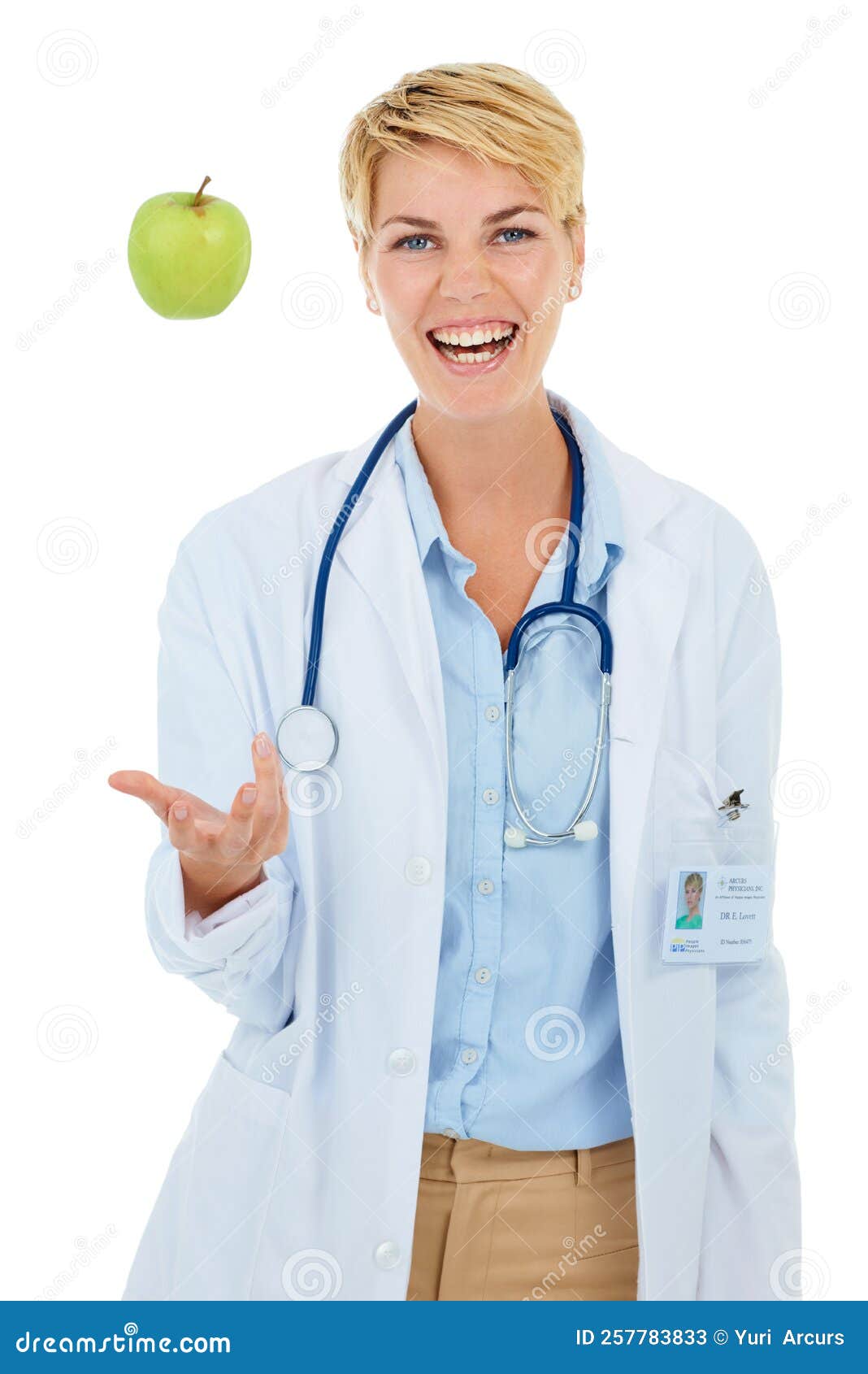 She Knows The Importance Of A Healthy Diet. A Young Smiling Doctor ... She Knows The Importance Of A Healthy Diet. A Young Smiling Doctor ...