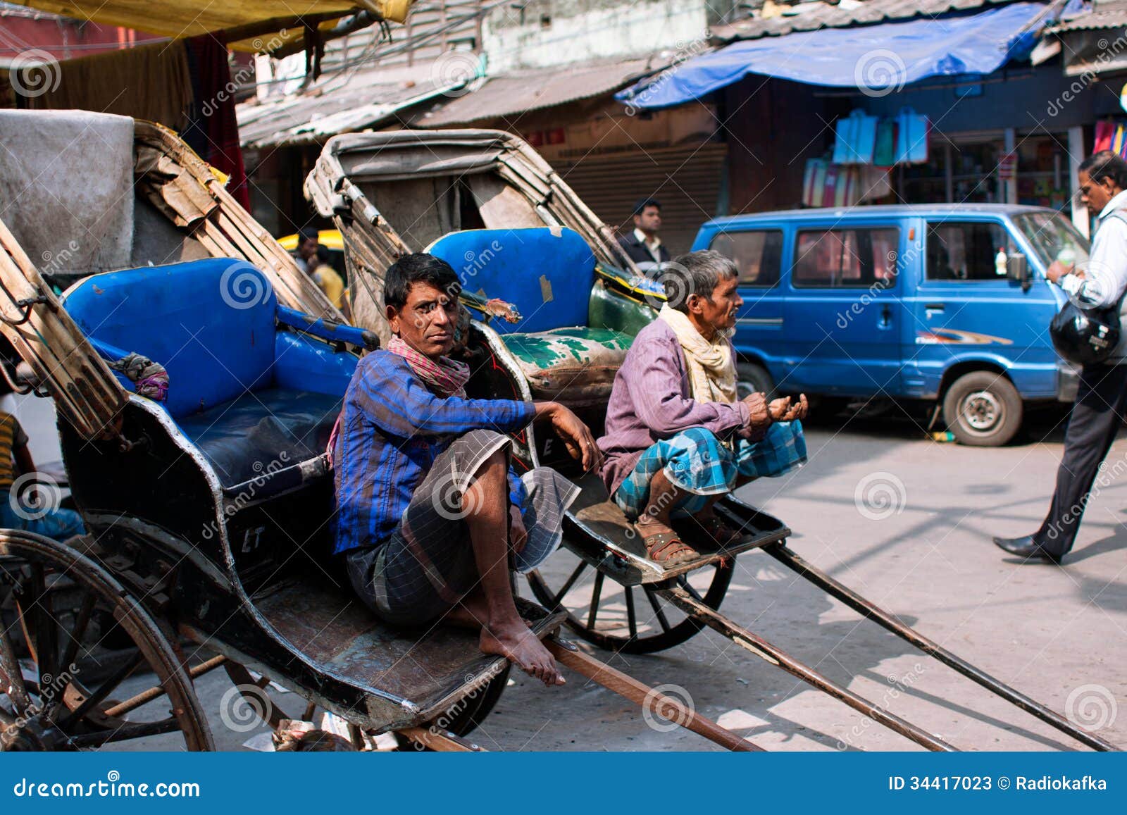 KOLKATA, INDIA: Elderly Workers of Hand-pulled Rickshaw Sit Outdoor and ...